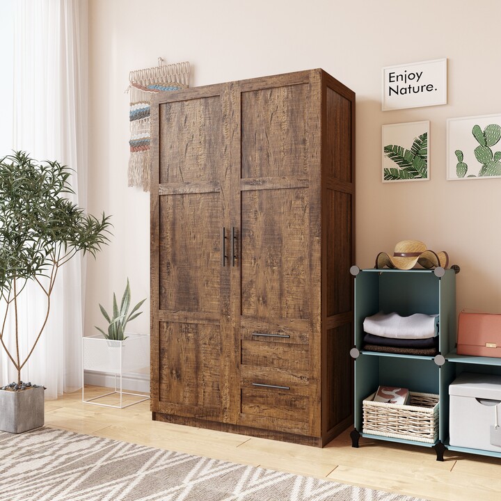 High wardrobe with large storage spaces - ShopStyle Dressers & Armoires