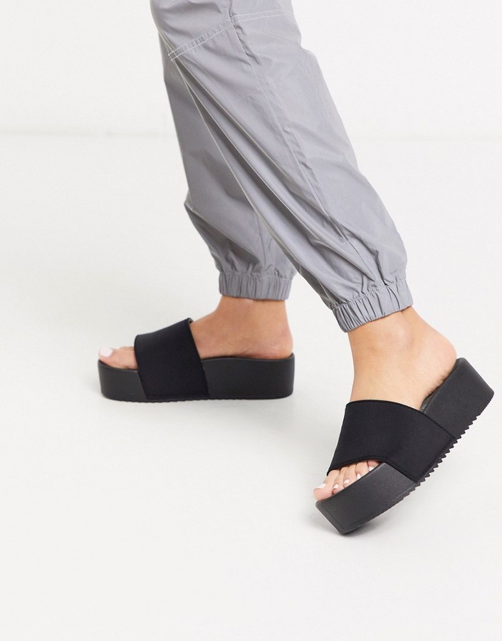 ASOS DESIGN Focused flatform sliders in black - ShopStyle Sandals