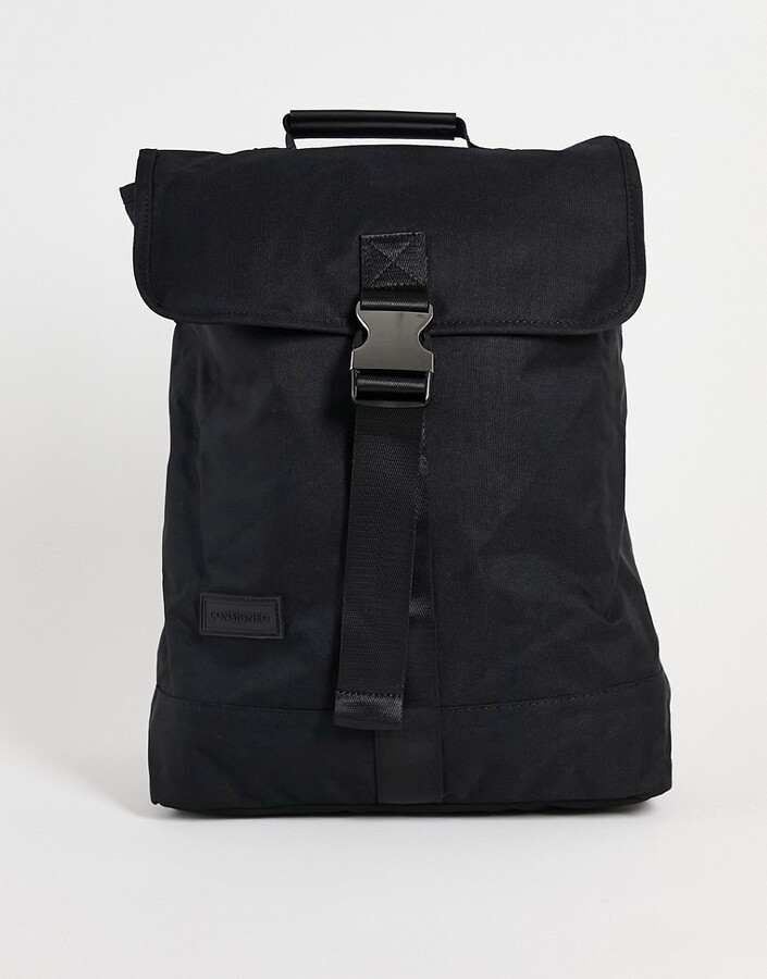 Consigned flap over backpack in black - ShopStyle