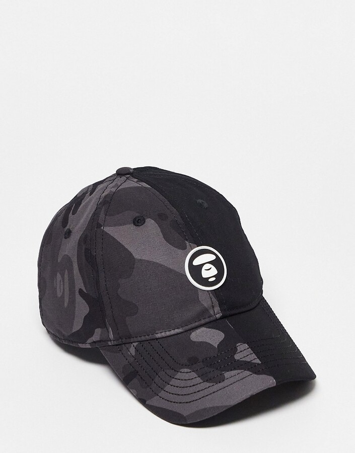 AAPE BY A BATHING APE® AAPE logo cap in half camo print in black ...