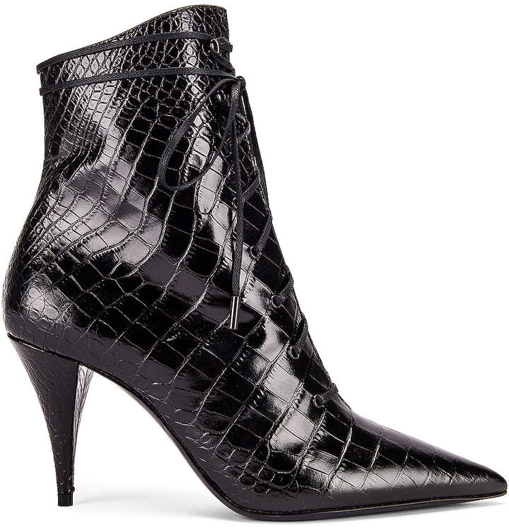 Saint Laurent Kiki Lace Up Booties in Black | FWRD - ShopStyle Boots