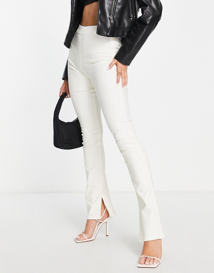 Stradivarius coated flare jeans with split hem detail in ecru - ShopStyle