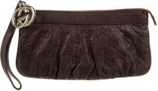 Gucci GG Signature Wristlet - ShopStyle Clutches