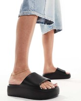 ASOS DESIGN Wide Fit Freedom cleated flatform slides in black - ShopStyle