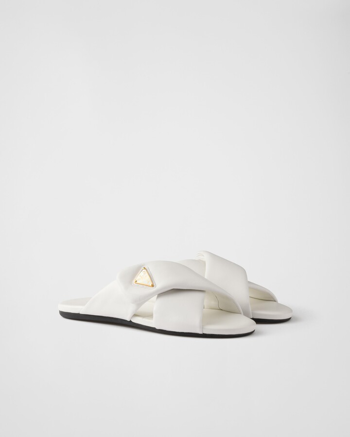 Prada Padded nappa leather slides - ShopStyle Mules