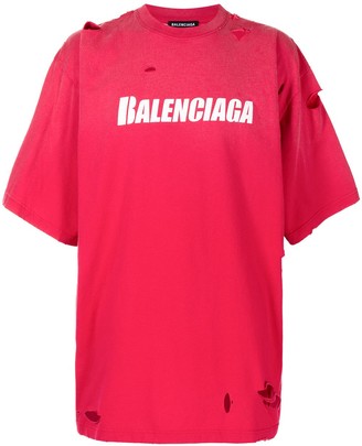Balenciaga ripped oversize logo T-shirt - ShopStyle