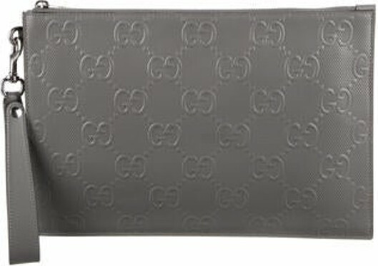 Gucci GG Embossed Pouch - ShopStyle Clutches