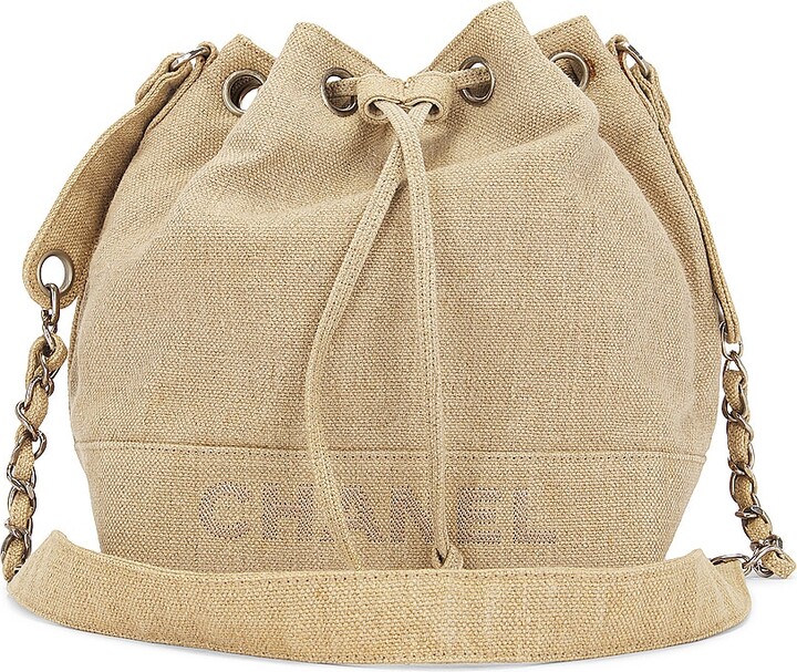Chanel Logo Drawstring Bucket Bag in Beige - ShopStyle