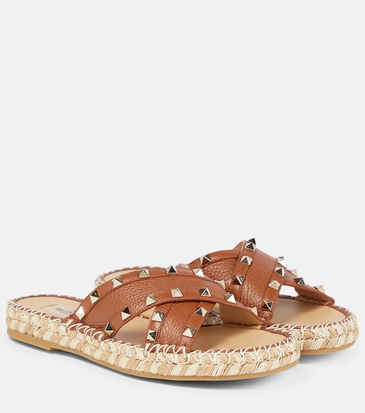 Valentino Garavani Rockstud leather and raffia slides - ShopStyle Mules