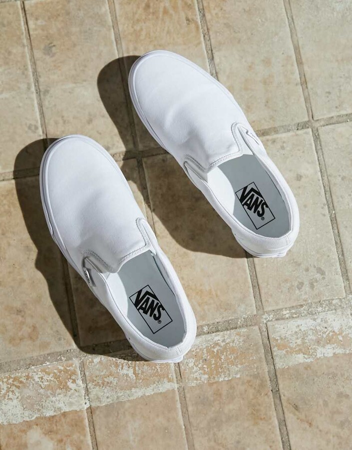 Vans Classic Slip-On plimsolls in white - ShopStyle Sneakers & Athletic ...