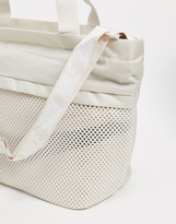 Nike oversized swoosh tote bag in cream - ShopStyle