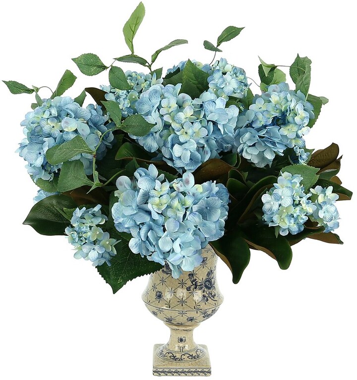 Creative Displays White Hydrangeas And Magnolia Leaves Arranged In A ...