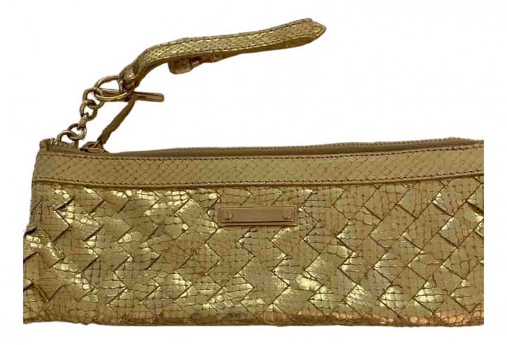 Burberry Gold Python Clutch bags - ShopStyle