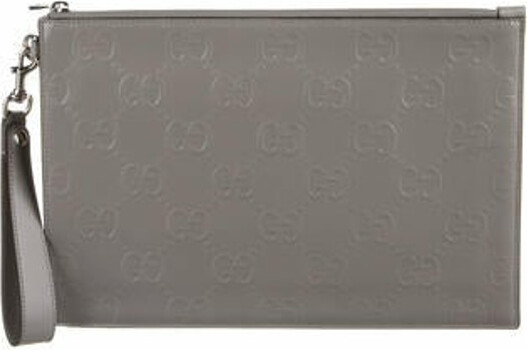 Gucci GG Embossed Pouch - ShopStyle Clutches