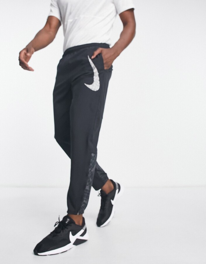 Nike Running Phenom Elite woven trackies in black - ShopStyle Trousers