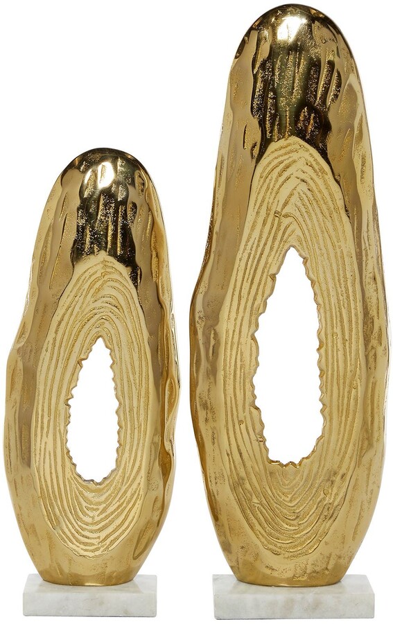 Willow Row Tall Abstract Gold Metal Tree Trunk Sculptures on Marble ...