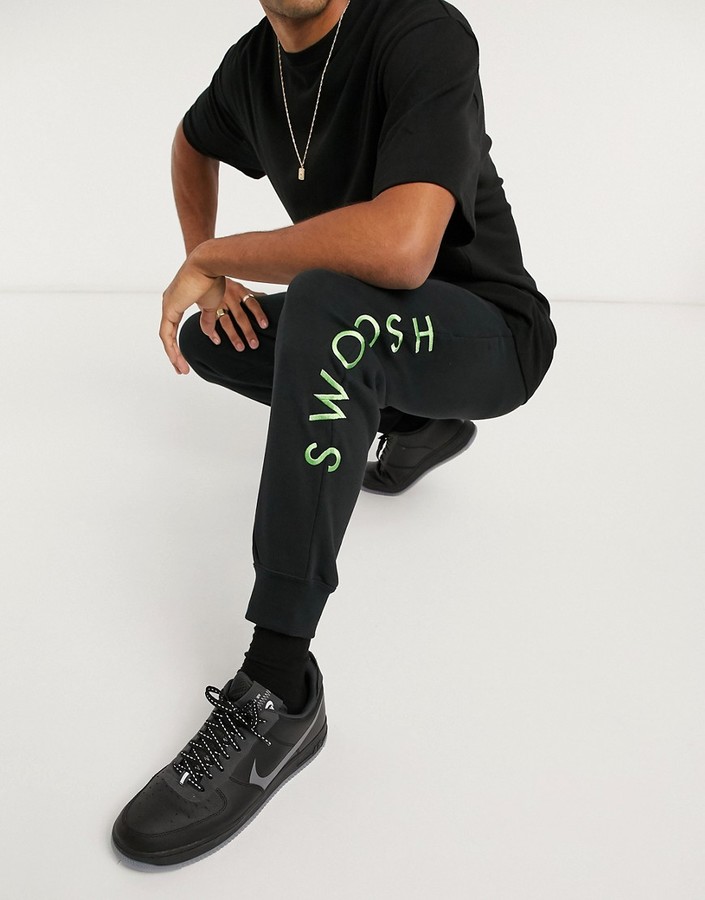 Nike Swoosh Cuffed Joggers In Black Shopstyle Trousers