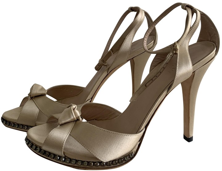 Gucci gold Leather Heels - ShopStyle Wedges